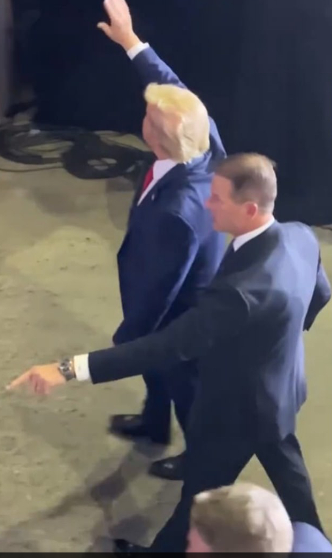 Moment Secret Service race to protect Trump after phone is thrown at ...
