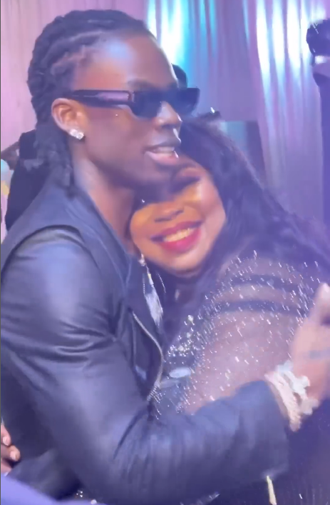 Singer Rema pictured with his mother at an event in his home state Edo